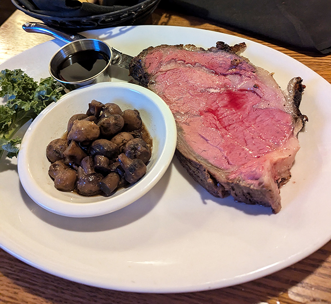Prime rib cooked to a perfect rosy medium-rare alongside mushrooms that have found their true calling—a plate that speaks the universal language of "Oh my goodness!"