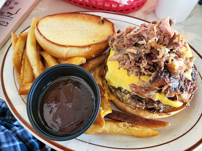 This pulled pork sandwich doesn't just sit on the plate&mdash;it commands attention with its towering stack of smoky meat and melted cheese.