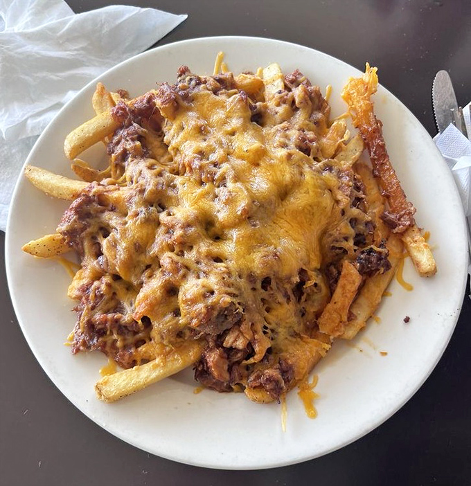 Loaded fries that laugh in the face of diet plans. This mountain of cheese and meat is what cheat days were invented for.
