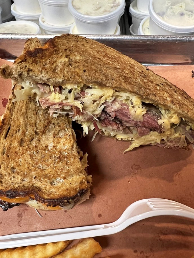 This isn't just a sandwich&mdash;it's a structural marvel. Layers of smoky meat and tangy slaw between toast that somehow maintains its integrity against all odds.