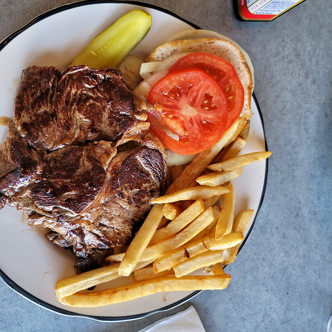 A steak sandwich that doesn't mess around&mdash;serious meat for serious appetites, with fries standing at attention alongside like loyal soldiers.