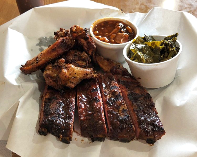 The barbecue sampler that makes decision-making unnecessary. Ribs, wings, and sides&mdash;it's like the greatest hits album of smoked meat classics.