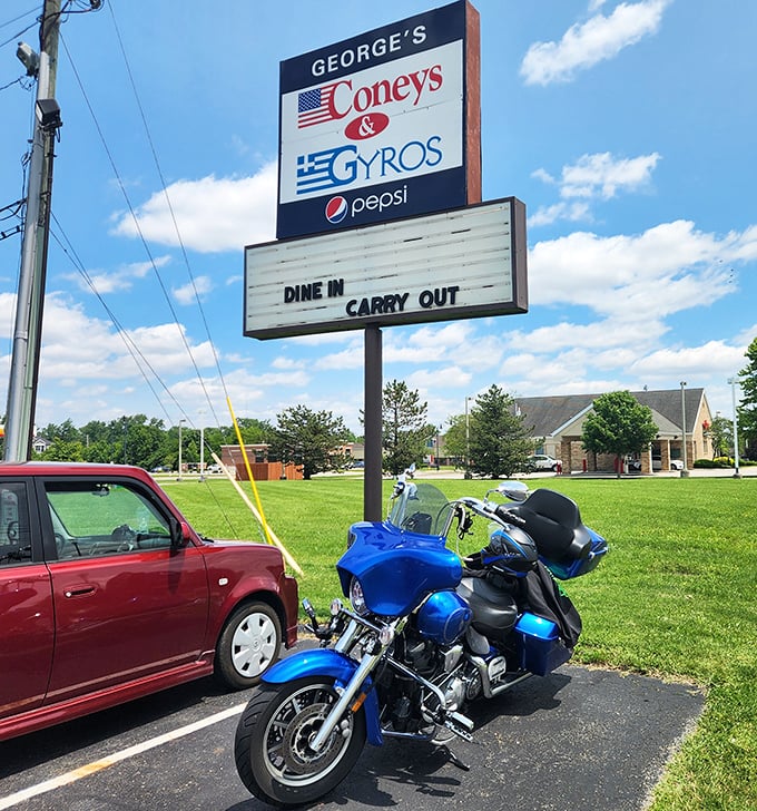 The roadside sign stands tall and proud, waving both American and Greek flags &ndash; a beacon for hungry travelers seeking cross-cultural comfort food.