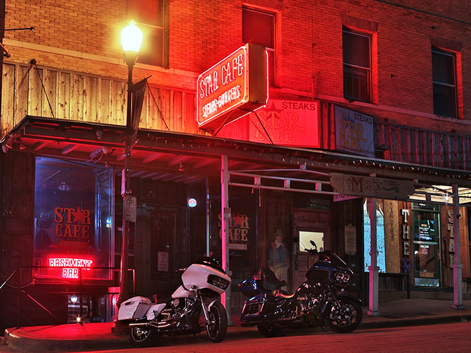 As night falls, the neon glow of Star Cafe beckons hungry souls like a lighthouse for those navigating the seas of mediocre dining options.