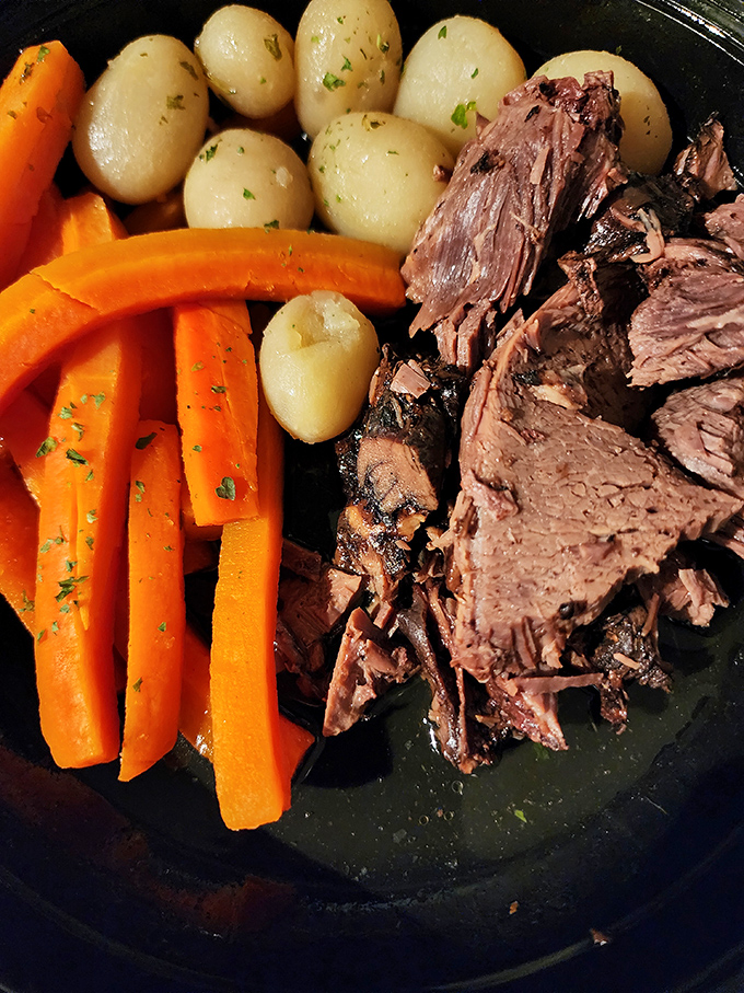 Sunday dinner on a plate: fork-tender roast beef with potatoes and carrots that taste like they've been simmering since church let out.