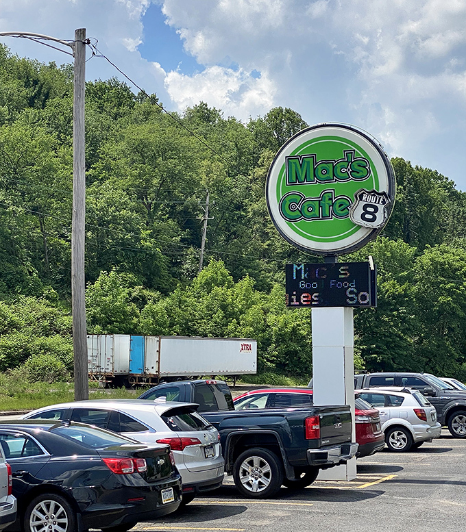 The roadside sign that's guided hungry travelers to hash brown heaven for years, standing tall against Pennsylvania greenery like a beacon of breakfast hope.