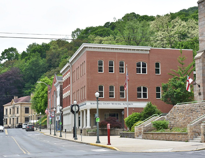 Nestled against verdant Pennsylvania hills, this municipal building balances practical purpose with the quiet dignity that characterizes Pottsville's public architecture.