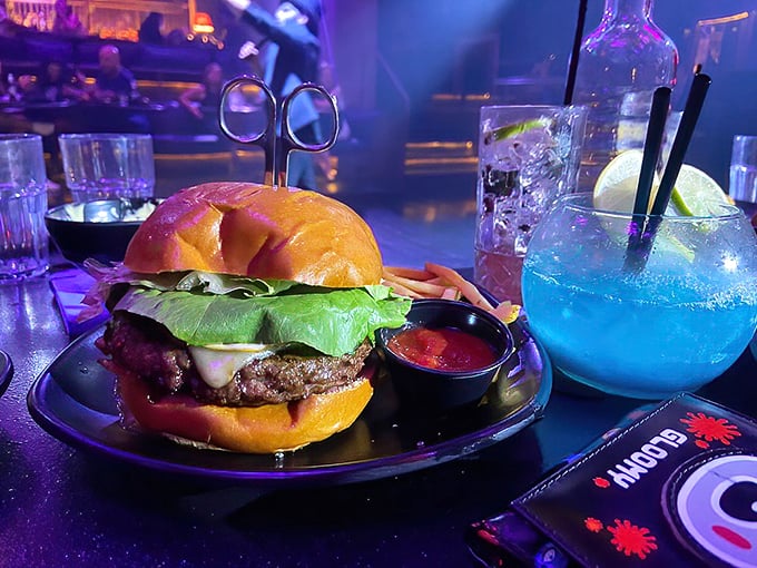 The "Scissor Burger" arrives alongside a glowing blue potion. This isn't just dinner—it's an Instagram moment waiting to happen.