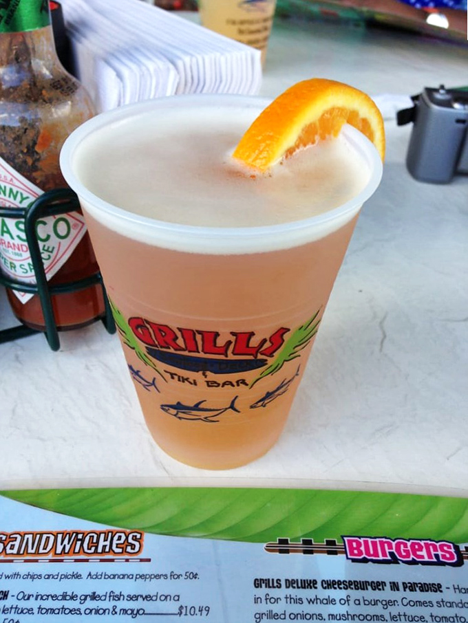 A frosty Shock Top with an orange slice perched on the rim—because sometimes paradise is as simple as a cold beer with a water view.