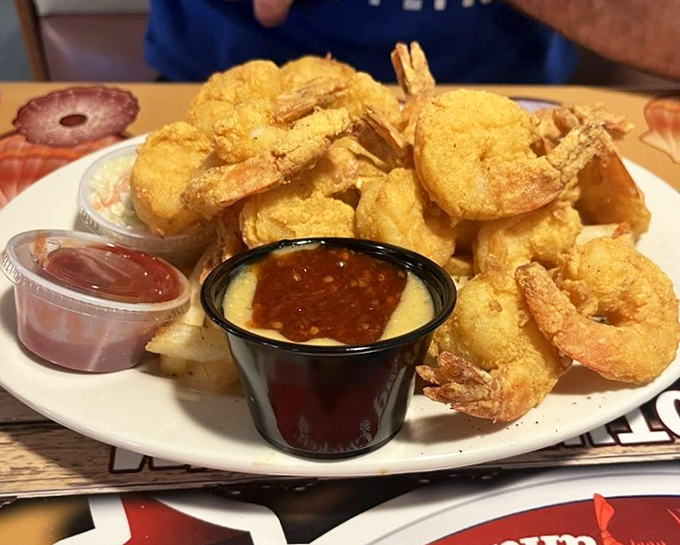 Fried shrimp so perfectly golden they deserve their own trophy. The cocktail sauce is just there to make them feel humble.