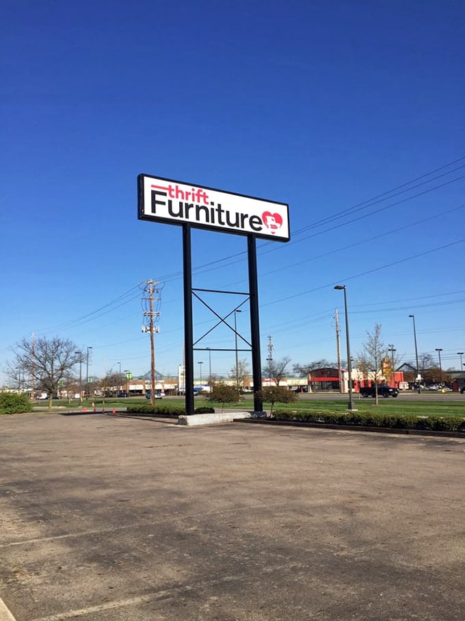 Follow the sign to savings! The roadside beacon of Furniture with a Heart stands tall against the Ohio sky, guiding thrifters to treasure.