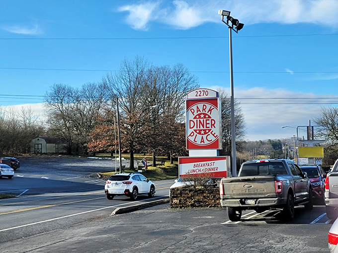 Roadside sign proudly announces breakfast, lunch, and dinner &ndash; your invitation to comfort food paradise.