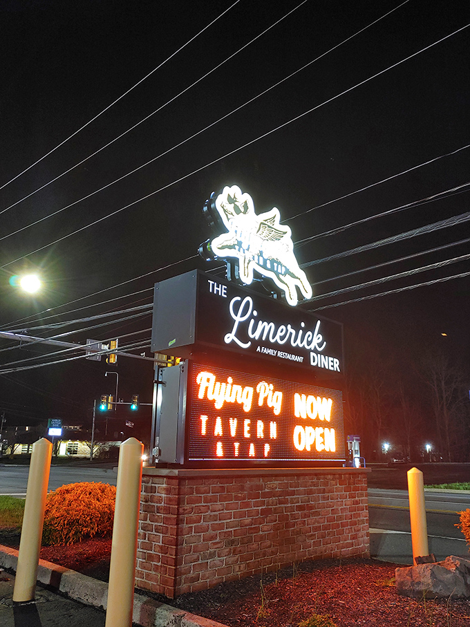 The illuminated sign serves as a nighttime lighthouse, guiding hungry travelers to this port of culinary comfort in Limerick's sea of dining options.