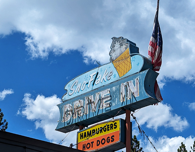 That vintage neon sign against a perfect blue sky&mdash;a beacon of hope for the hungry traveler and a promise of deliciousness to come.