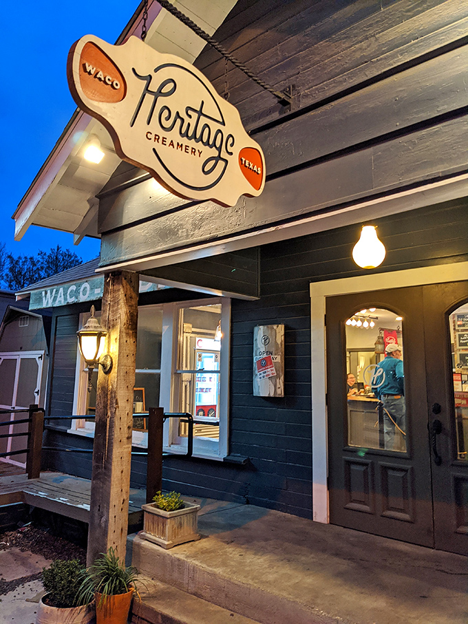 As dusk falls, the Heritage Creamery sign glows like a lighthouse, guiding dessert lovers safely to shore.