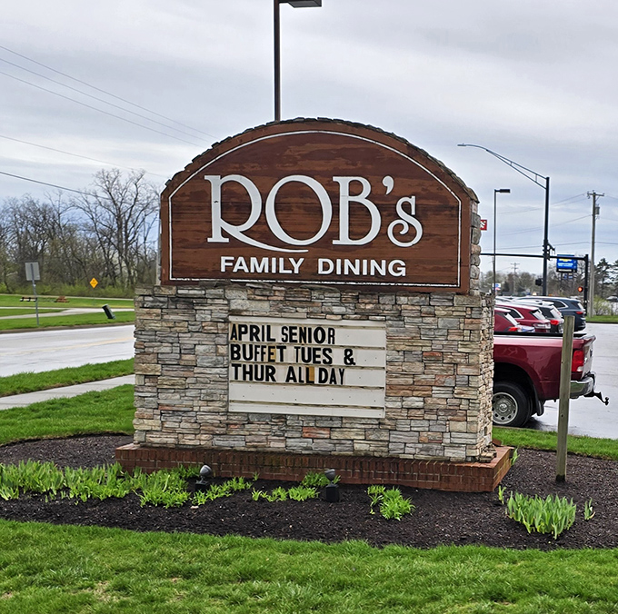 The roadside sign announces Rob's presence like a beacon to hungry travelers&mdash;special buffet days are marked with the importance they truly deserve.