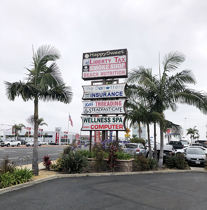 Nestled among palm trees and SoCal sunshine, this unassuming sign points the way to one of Huntington Beach's sweetest treasures.