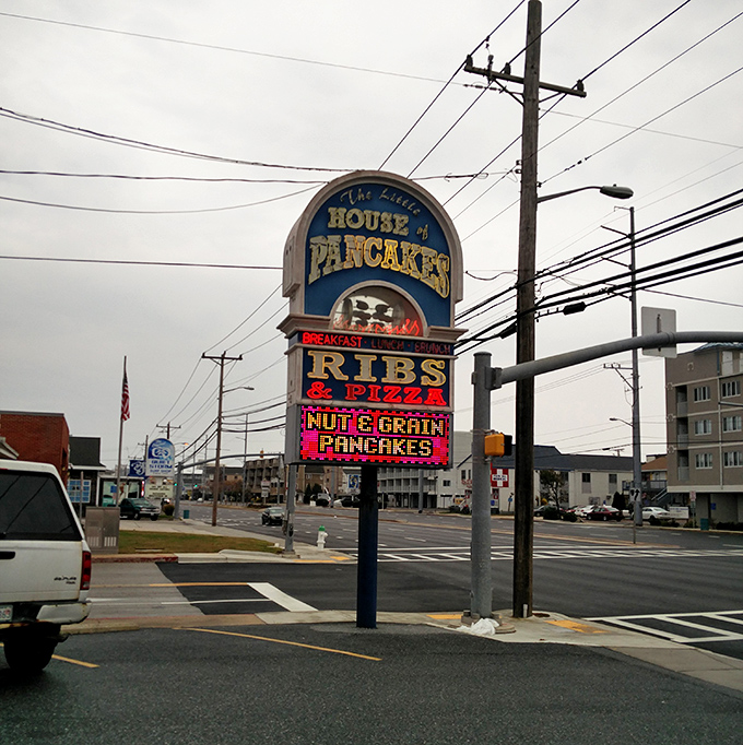 The sign that's guided hungry travelers to pancake nirvana for generations. Those red letters spelling "RIBS" hint at the day's journey ahead.