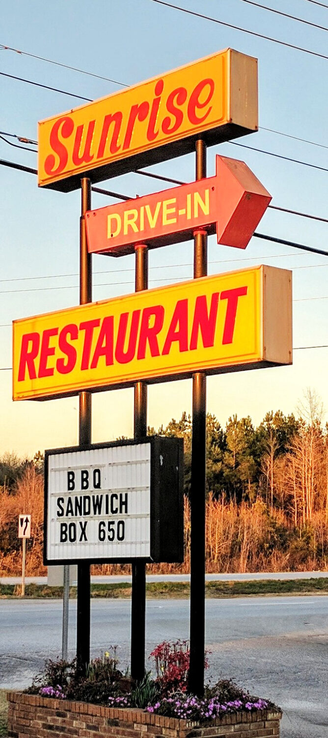 The sign stands tall against the South Carolina sky, a yellow and red landmark that's guided hungry travelers for decades. BBQ sandwich box for $6.50? Yes, please.