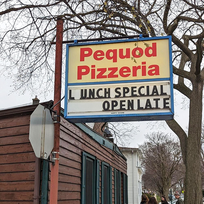 The iconic sign beckons pizza pilgrims like a lighthouse guiding hungry sailors home. "Open Late" &ndash; two beautiful words.