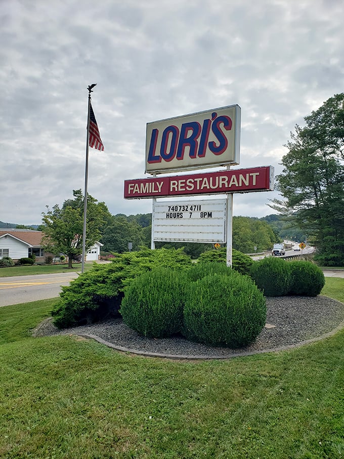 An American flag stands guard beside the iconic sign. Lori's isn't just a restaurant&mdash;it's a landmark that measures time in memorable meals.