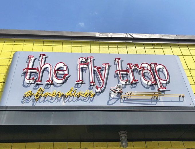 Neon signs: the universal language for "good times ahead." This one practically hums with the promise of perfectly crisped potatoes and strong coffee.