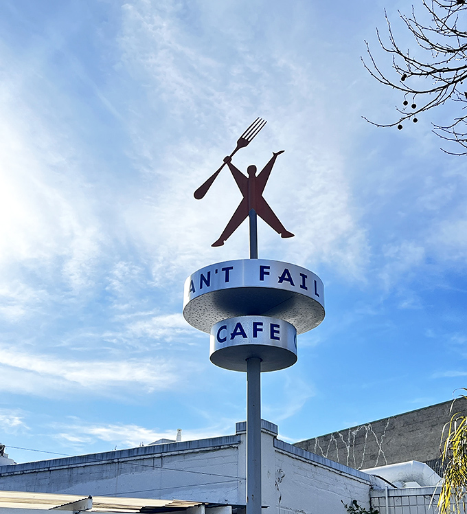 The iconic fork-wielding figure atop Rudy's sign stands triumphant against the sky&mdash;a monument to the eternal victory of good diners everywhere.