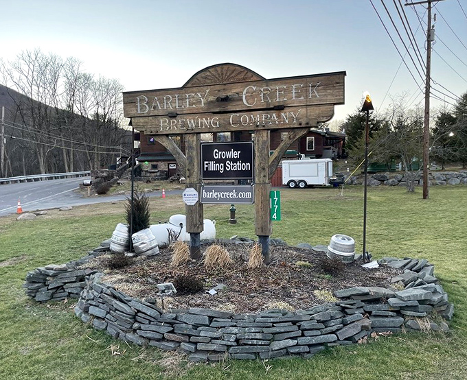 The sign that's welcomed countless hungry travelers, standing like a rustic beacon of good food and cold beer in the Pocono landscape.