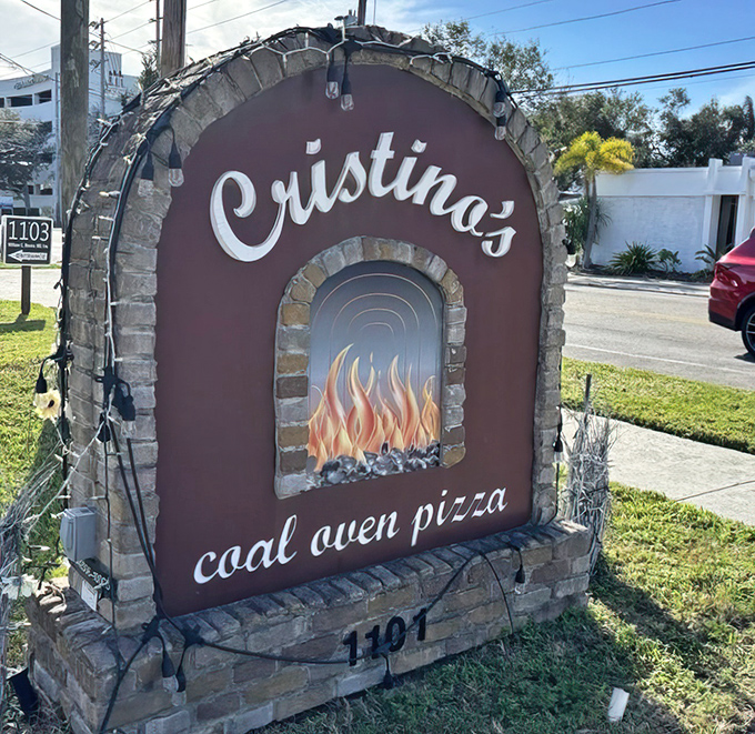 The sign that launches a thousand cravings. This distinctive marker has become a beacon for pizza lovers throughout the Tampa Bay area.