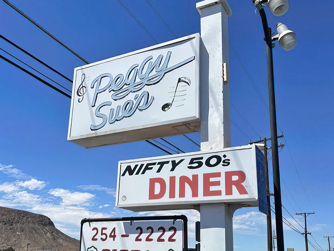 The roadside sign stands tall against the desert sky, a musical note-adorned beacon for hungry travelers seeking refuge from fast food monotony.