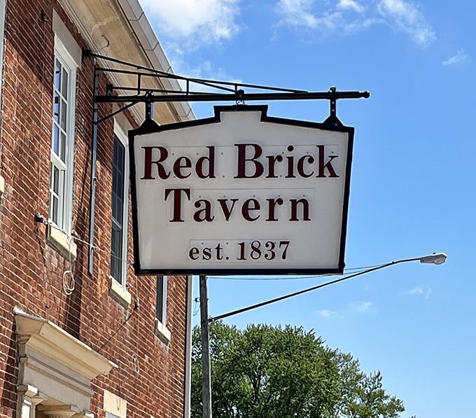 
The simple hanging sign announces the tavern's presence without fanfare&mdash;just like the establishment itself, letting its centuries-old reputation do the talking. 