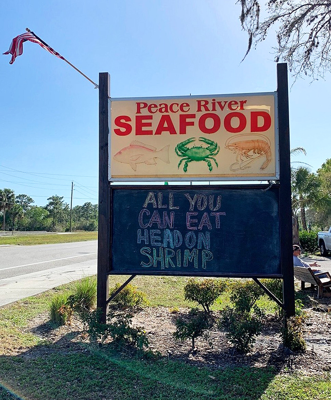 A sign that promises exactly what seafood lovers crave. "All you can eat headon shrimp" might be the four most beautiful words in English.