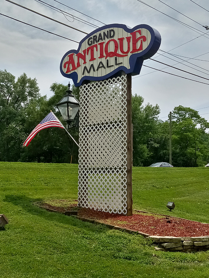 The Grand Antique Mall sign stands like a retro lighthouse, guiding treasure hunters to shores of nostalgia and unexpected finds.