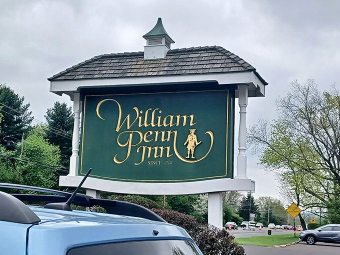 The William Penn Inn sign stands as a landmark of culinary tradition, promising the kind of meal that makes you plan your next visit before finishing the first.