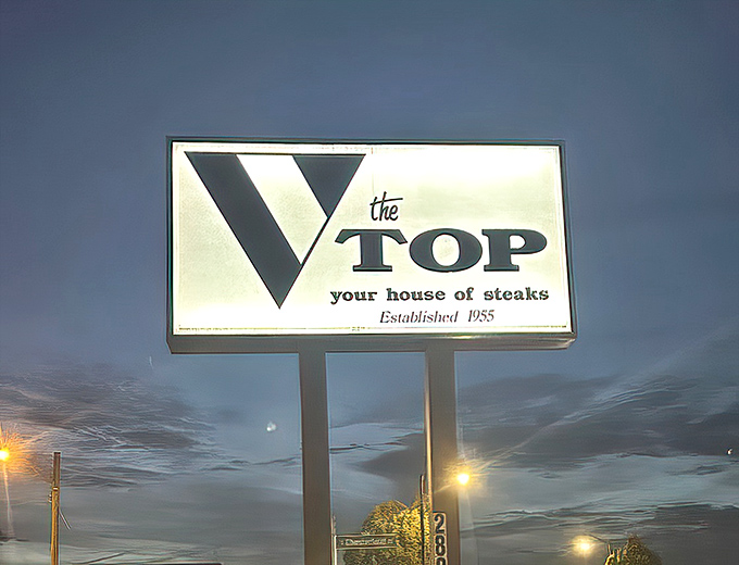 The vintage sign glows against the twilight sky, a beacon for hungry travelers. "Your house of steaks" isn't just a tagline&mdash;it's a promise.