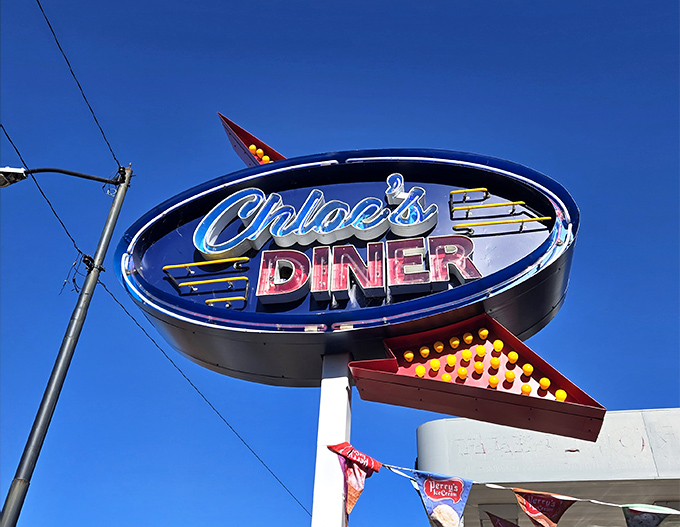The neon sign beckons hungry travelers like a beacon of hope on the American dining landscape.