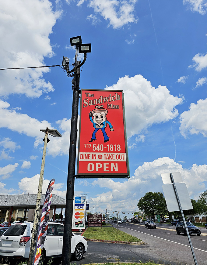 The roadside sign stands like a beacon of hope for the hungry traveler&mdash;a colorful promise of sandwich salvation just ahead.