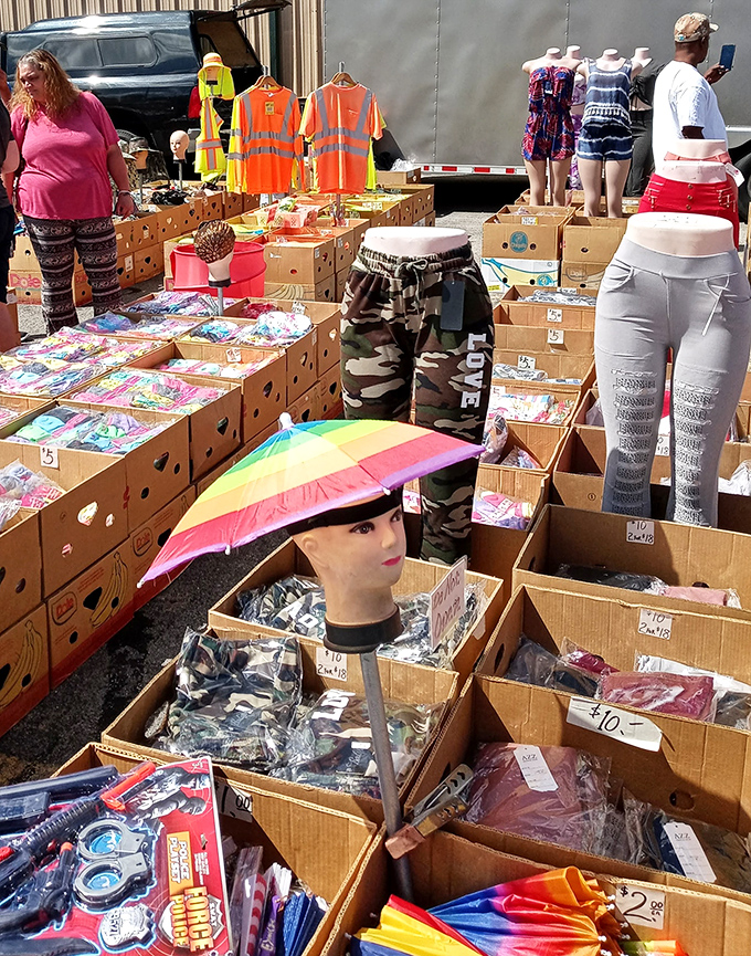 The mannequin head modeling a rainbow umbrella hat perfectly captures the flea market spirit: practical, whimsical, and utterly unexpected.