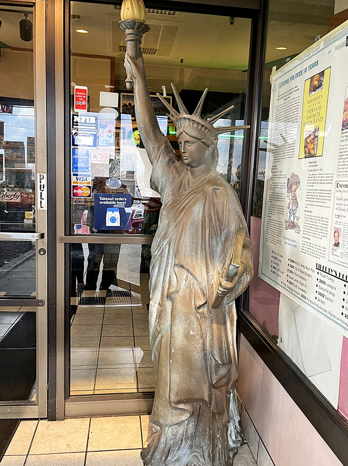 Lady Liberty herself stands guard at the entrance, promising freedom from hunger and the pursuit of happiness through pancakes.