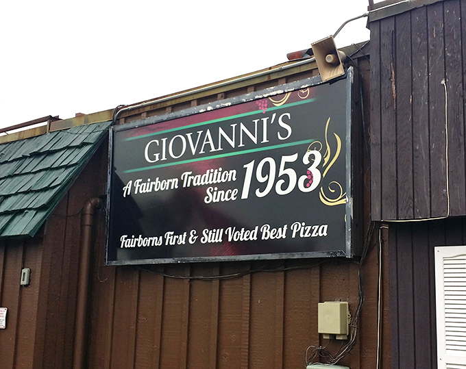 The sign says it all: voted best pizza since 1953. Some traditions don't need updating, just respect and extra cheese.