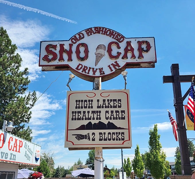 The vintage Sno Cap sign stands as a beacon for hungry travelers, a North Star of comfort food guiding weary souls toward burger salvation.