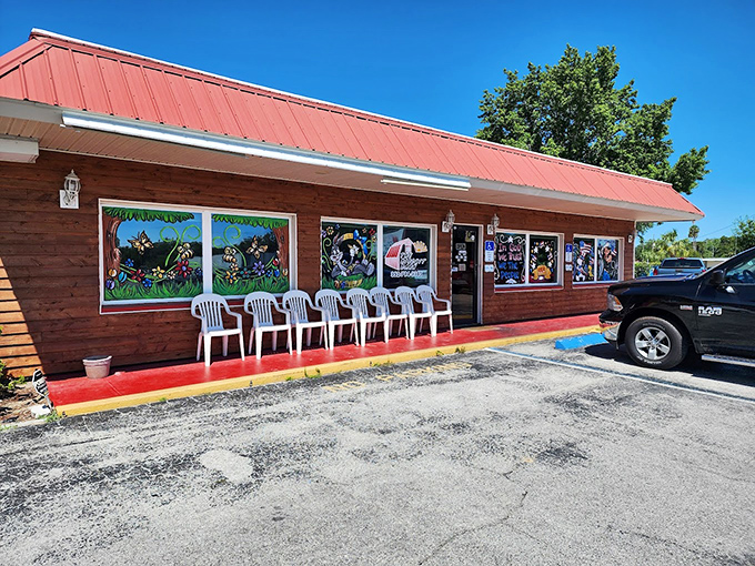 Morning sunshine bathes the wooden exterior in golden light. Those plastic chairs out front? Perfect for the inevitable wait on busy mornings.