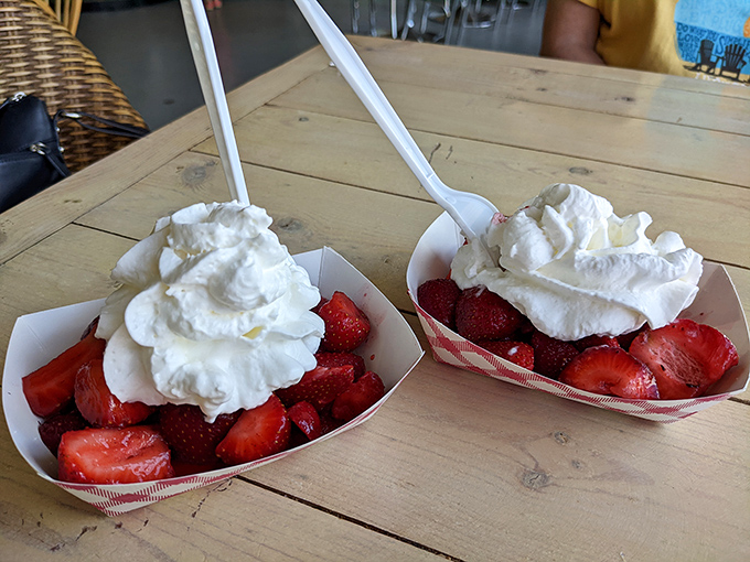 Fresh strawberries crowned with clouds of whipped cream&mdash;nature's perfect dessert that somehow tastes even better when eaten at a weathered wooden table.
