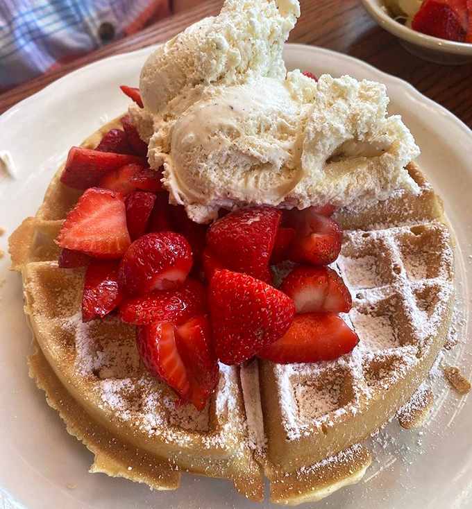 A Belgian waffle crowned with strawberries and ice cream&mdash;because sometimes breakfast should feel like you're getting away with something.