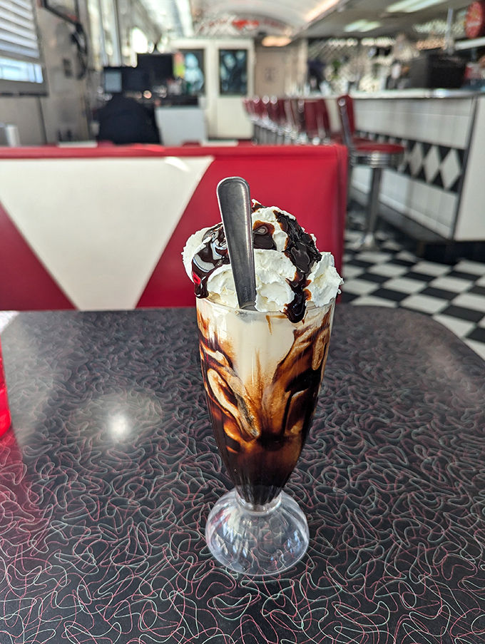 This hot fudge sundae isn't just dessert&mdash;it's therapy in a glass. The chocolate sauce is making a dramatic entrance worthy of a standing ovation.