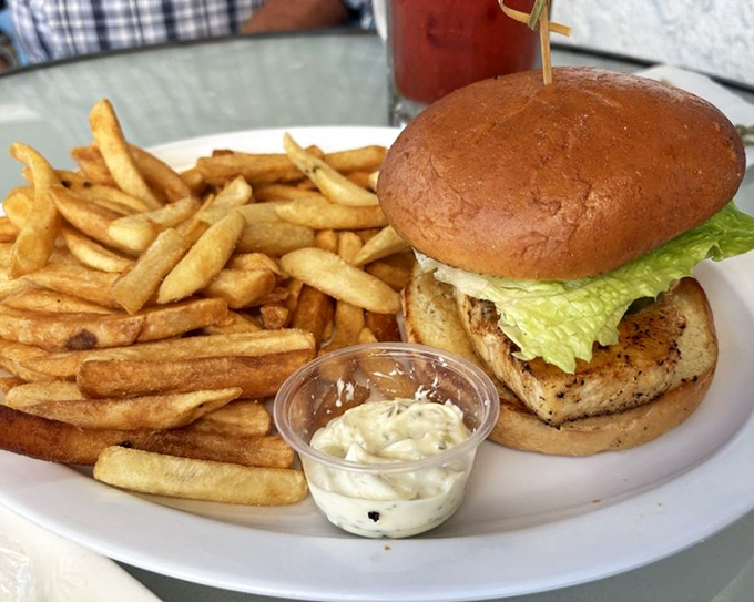 This sandwich isn't just lunch; it's a portable feast with a side of golden fries that whisper, "Go ahead, have just one more."