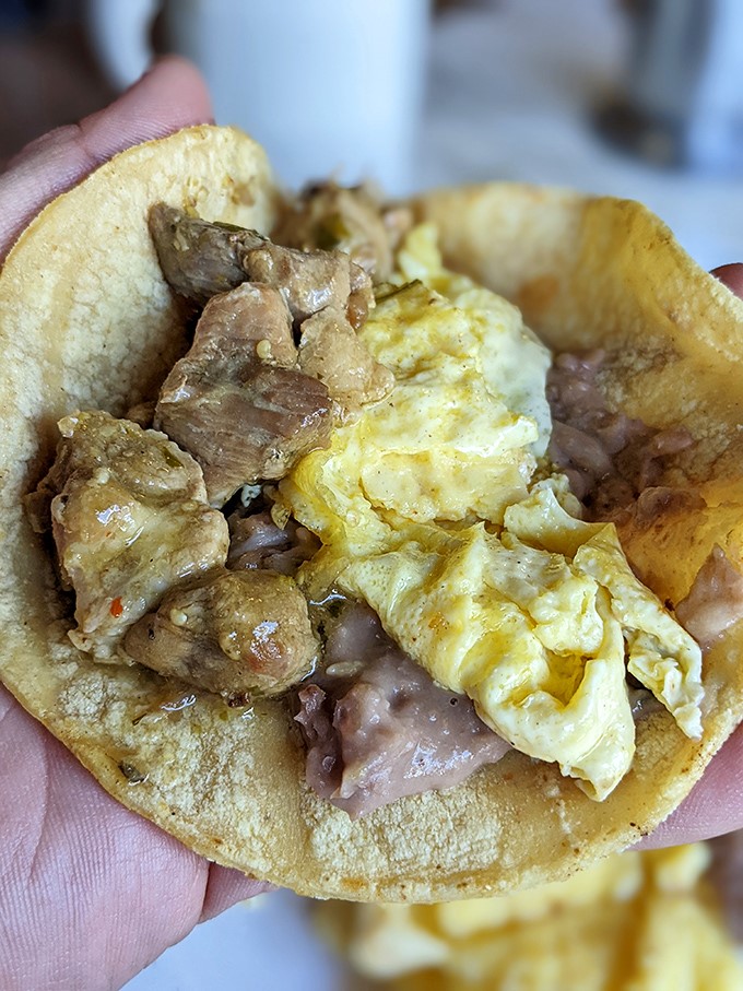 The humble breakfast taco cradles a perfect marriage of eggs, meat, and beans&mdash;proof that the best hand-held morning meals don't need fancy packaging, just honest flavor.
