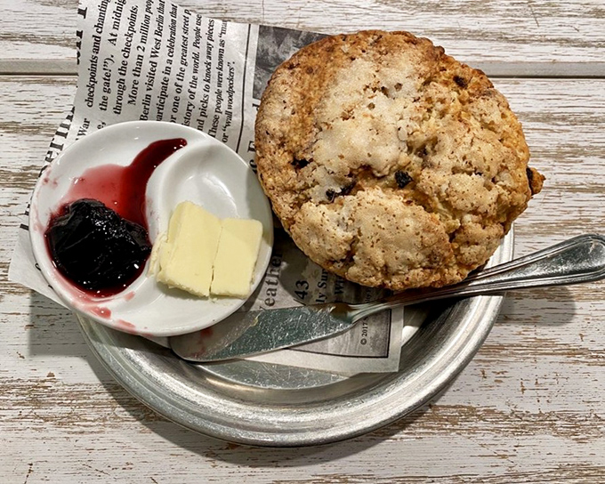 The humble scone, served with butter and jam, proves that sometimes the simplest pleasures deliver the most satisfaction.