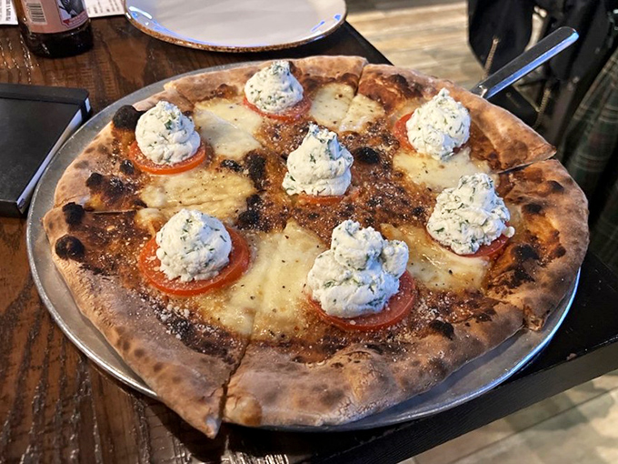 The Bianca pizza with dollops of what appears to be herbed ricotta &ndash; proof that sometimes the absence of tomato sauce is actually a blessing. 