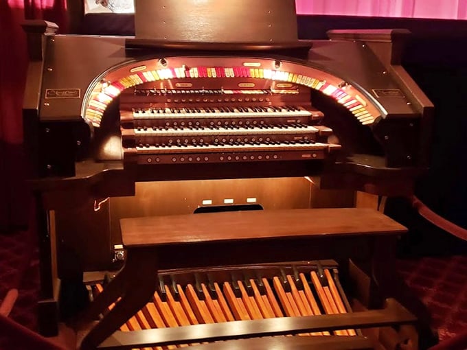 The theater organ sits ready to transport audiences to the silent film era, its keys waiting to underscore dramatic moments with authentic vintage flair.